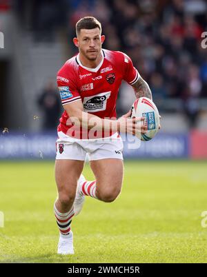 Cade Cust of Salford Red Devils holds his shoulder after a tackle ...