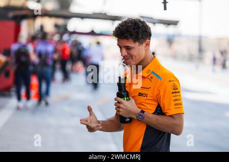 McLaren driver Lando Norris of Britain stands in the pit during a ...