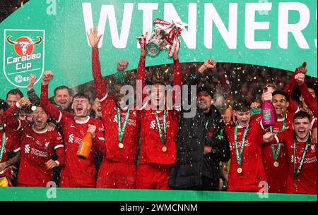 Liverpool's Virgil van Dijk lifts the Premier League trophy with team ...