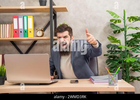 Angry stressed boss yelling at somebody during working day in office ...