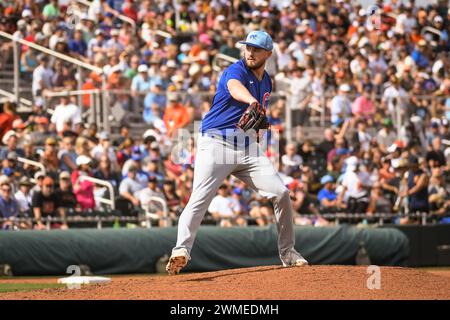 Chicago Cubs pitcher Luke Little fields a grounder at the Cubs baseball ...