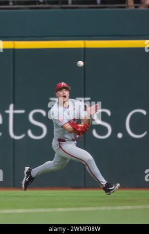 February 25, 2024: Ross Lovich #14 Arkansas right fielder moves over ...