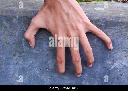 Open hand with horror Gesture impression isolated on rocks background ...