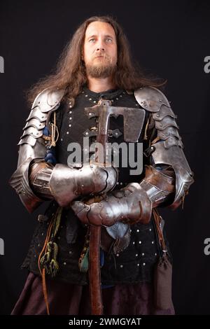 Vertical composition. Portrait of a medieval knight in shining armor ...