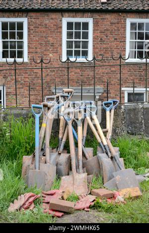 Spades and shovels at an archaeological dig, UK Stock Photo - Alamy