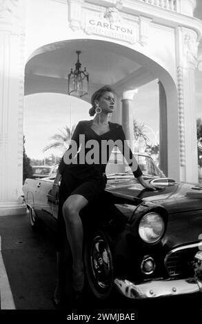 beauty top model classy dark hair woman with classic car in front ...