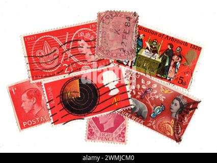 A montage of red vintage pre decimal postage stamps from the United ...