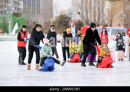 Children and parents enjoy snow activities during the Ice and Snow ...