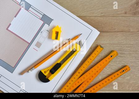 A top view closeup of a ruler, pencils, eraser, cutter, notebook, on ...