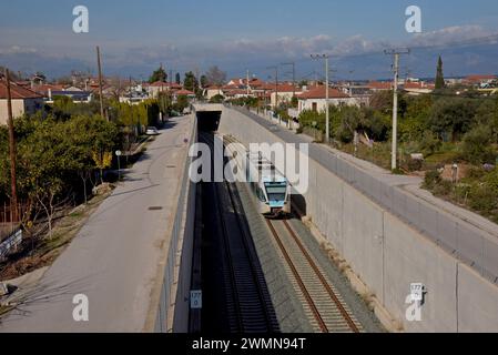 A diesel railcar of the OSE Greek railway leaving the main station in ...