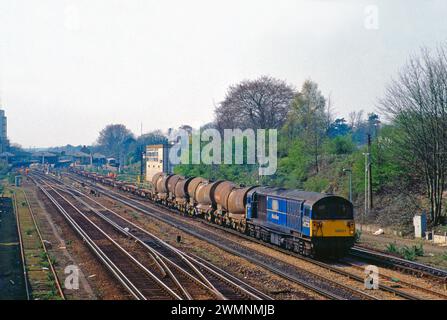 A class 58 diesel locomotive number 58039 with a train of bogie tanks ...