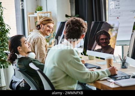 post production team discussing project near gadgets for retouching in ...