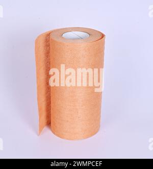 roll of white toilet paper over yellow background Stock Photo - Alamy