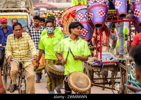 Drummers parade through the streets of Puri in Odisha / Orissa in India ...