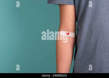 Arm with plaster, blood cells, donate plasma, world blood donor day ...