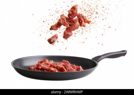 Beef milled meat flying from a pan, isolated on white background Stock ...