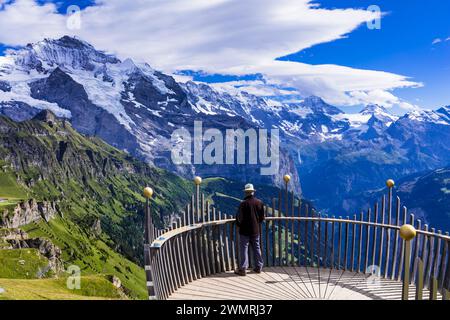 trekking in the alps in a snowy white winter landscape trekking in the ...