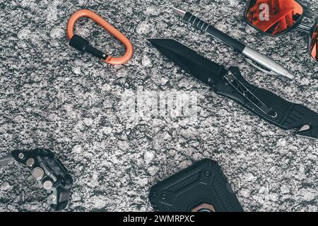 Flat lay of some Outdoor/EDC gear on a grey background Stock Photo - Alamy