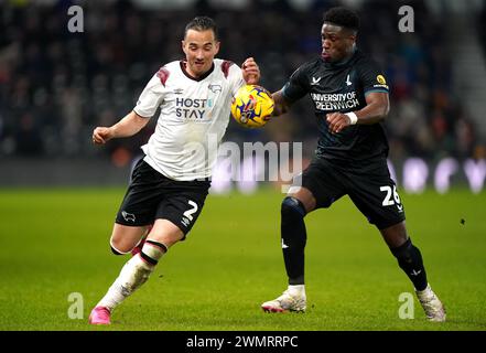 Derby County's Kane Wilson (left) and Blackburn Rovers' Yuri Ribeiro ...