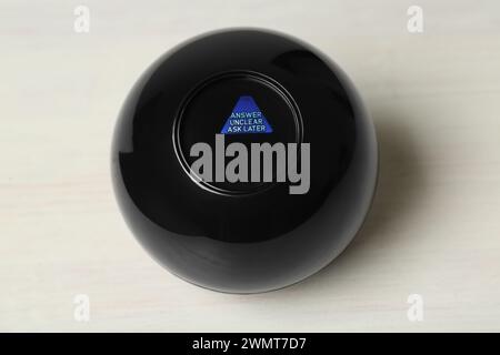 Magic eight ball with prediction Answer Unclear Ask Later on blue ...