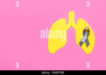 Yellow paper lungs with ribbon on pink background Stock Photo - Alamy