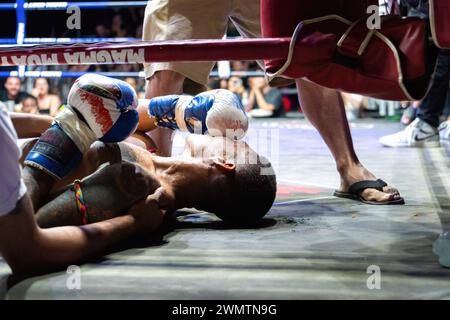 The Thai boxer Petch Si Nel is seen putting his glove on his face after ...