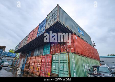 A typical view of the many old, stacked, reused shipping containers ...