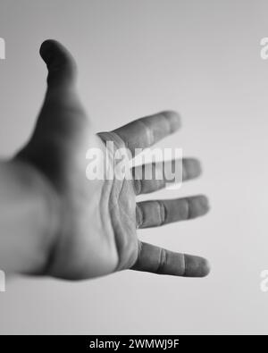 An Outstretched Hand Reaching Forward in a Close-up Shot Stock Photo ...