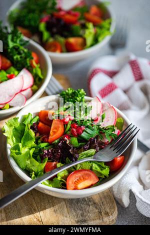 Cutting board with cherry tomatoes and lettuce on wooden planks ...