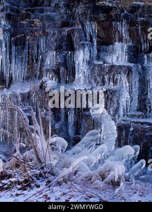 Frozen ice cycles hanging from rocks Stock Photo - Alamy