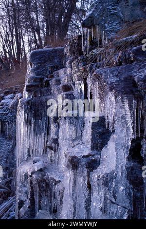 Frozen ice cycles hanging from rocks Stock Photo - Alamy