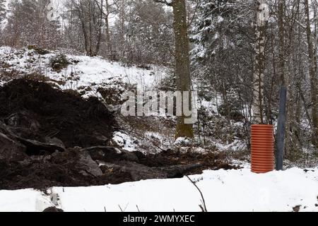 Trench with ventilation piping for home sewage under construction in ...