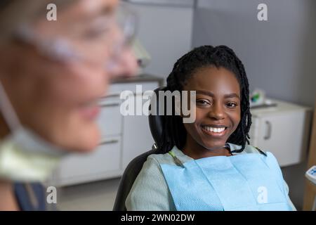 Multicultural lady in dental clinic doing teeth checkup Stock Photo - Alamy