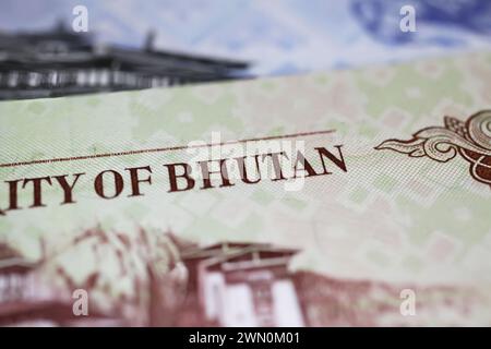 Closeup of old bhutan Ngultrum currency paper banknote (focus on center ...