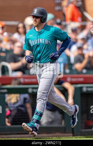 Seattle Mariners designated hitter Mitch Garver holds his 100th career home run ball during the ...