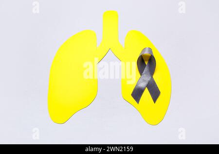 Yellow paper lungs with ribbon on grey background Stock Photo - Alamy