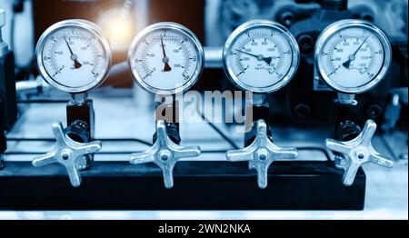 Row of industrial high pressure gas gauge meters Stock Photo - Alamy