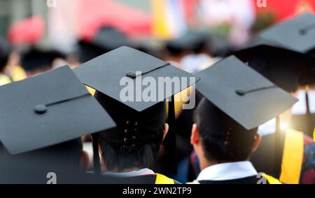 Back view of graduates during commencement Stock Photo - Alamy