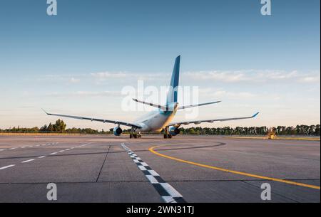 Passenger airplane on airport apron Stock Photo - Alamy