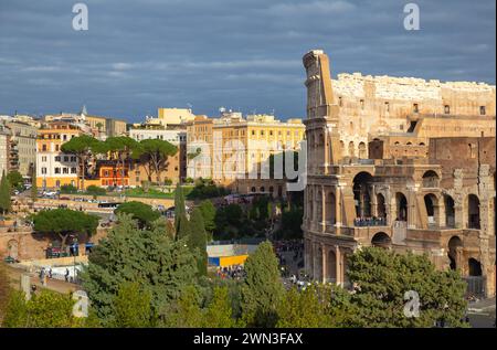 the colosseum under golden sunshine in Rome, Italy, tourist, travel ...