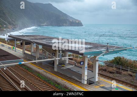 Overlook of the coastal railway track and platform with sea Stock Photo ...