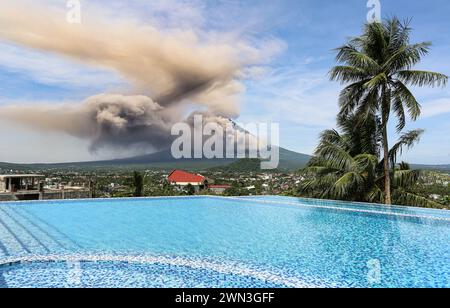 Cloud of smoke & pyroclastic flow sweep down the flanks of Mayon volcano in eruption, Legazpi ...