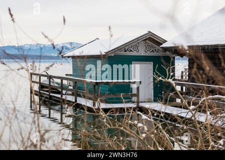 Boathouses with snow in winter, Tutzing, Lake Starnberg, Fuenfseenland ...