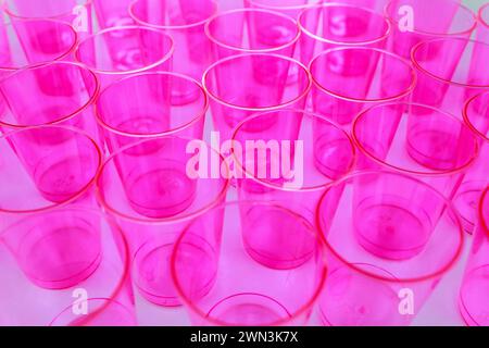 Plastic pink cups abstract background Stock Photo - Alamy