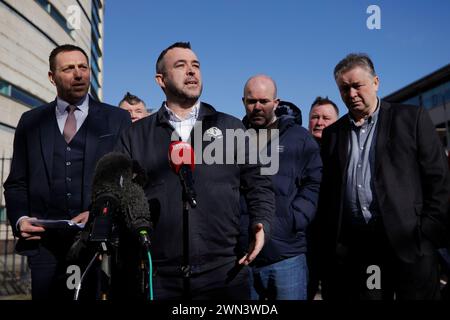 Kieran Fox (third from left), son of Eamon Fox, outside Belfast Crown ...
