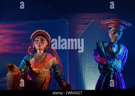 Puppeteers perform with puppets during the Tripura International Puppet ...