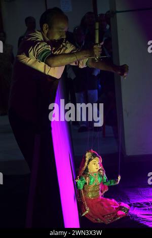 Puppeteers perform with puppets during the Tripura International Puppet ...