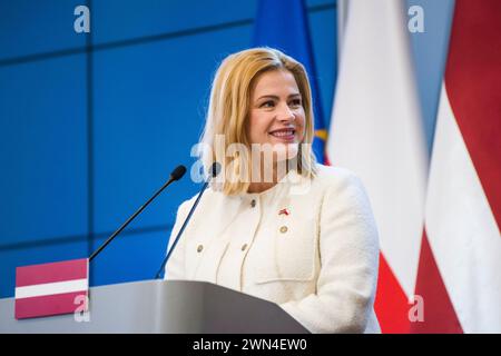 Latvia's Prime Minister Evika Silina and Sweden's Prime Minister Ulf Kristersson shake hands ...