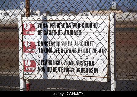 Sign at airport warning of jet blast from aircraft Stock Photo - Alamy