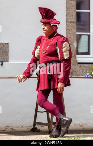 Saint Renan, France - July 16 2023: Man in medieval clothing chained to ...
